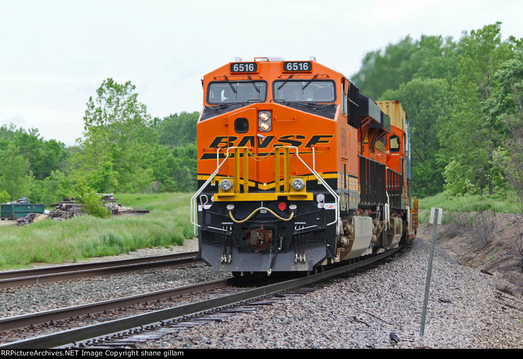 BNSF 6516 More C4's work a Wb stack train.
